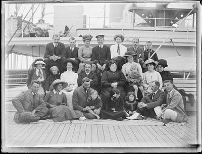 Glass plate: Group of people seated on bench and exterior deck of ship ...