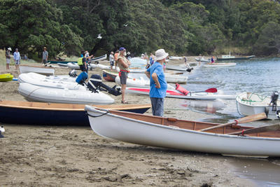Photograph: People and dinghies on beach, Sullivan's Bay, Mahurangi ...