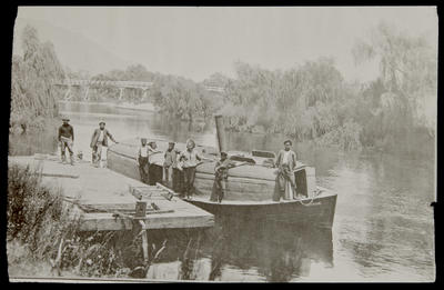 Negative: Small steamboat at Waihou River mooring with workmen, 1910 ...
