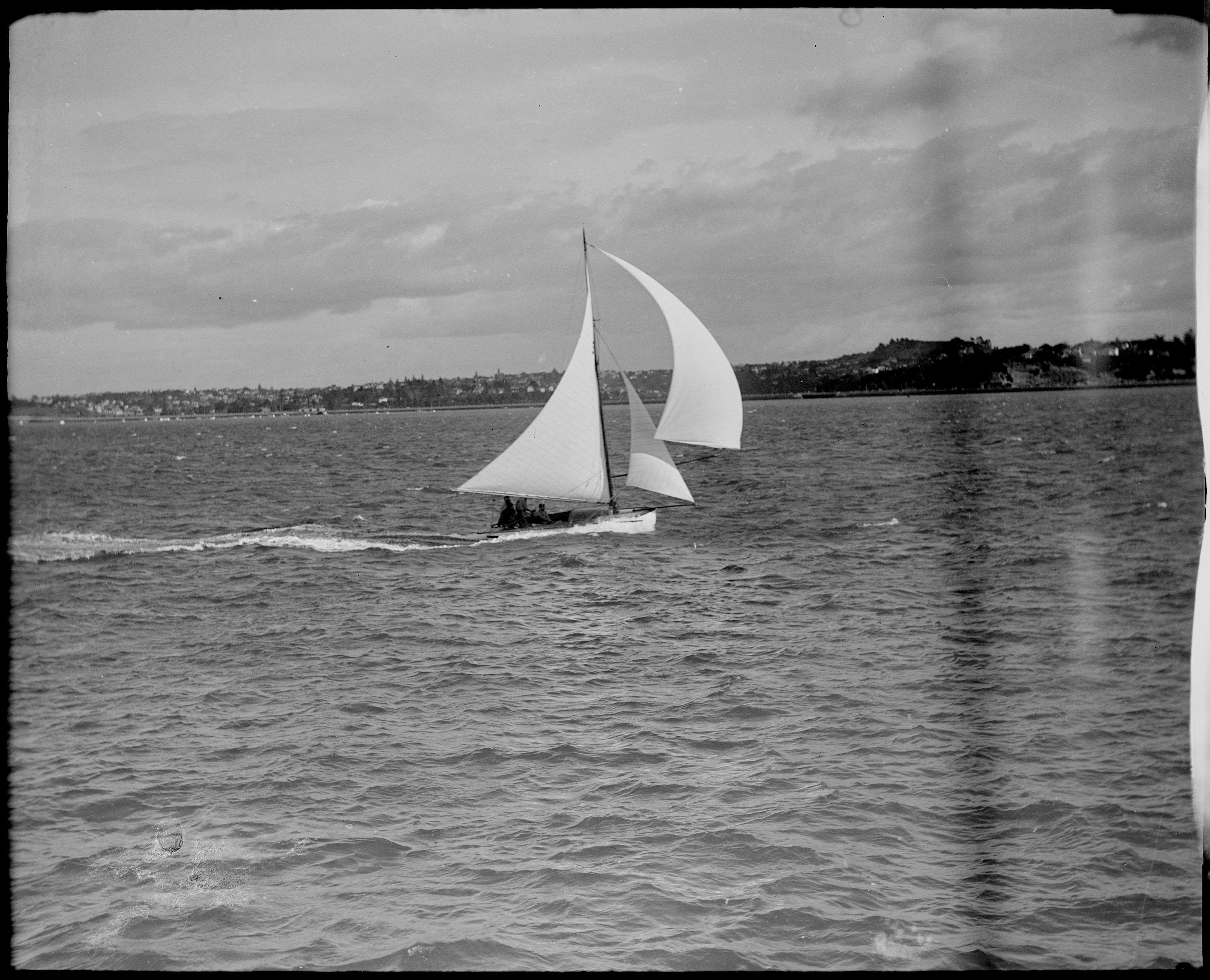 Negative: Unidentified sailing dinghy with sails luffed, on Waitematā ...