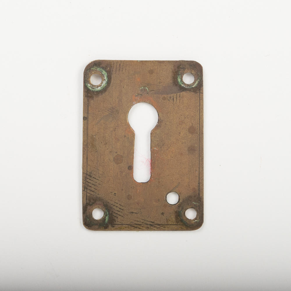 Small brass keyhole plate - New Zealand Maritime Museum