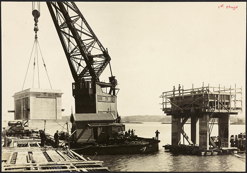 Photograph: Crane lifting the Portal House from the north wall to the ...