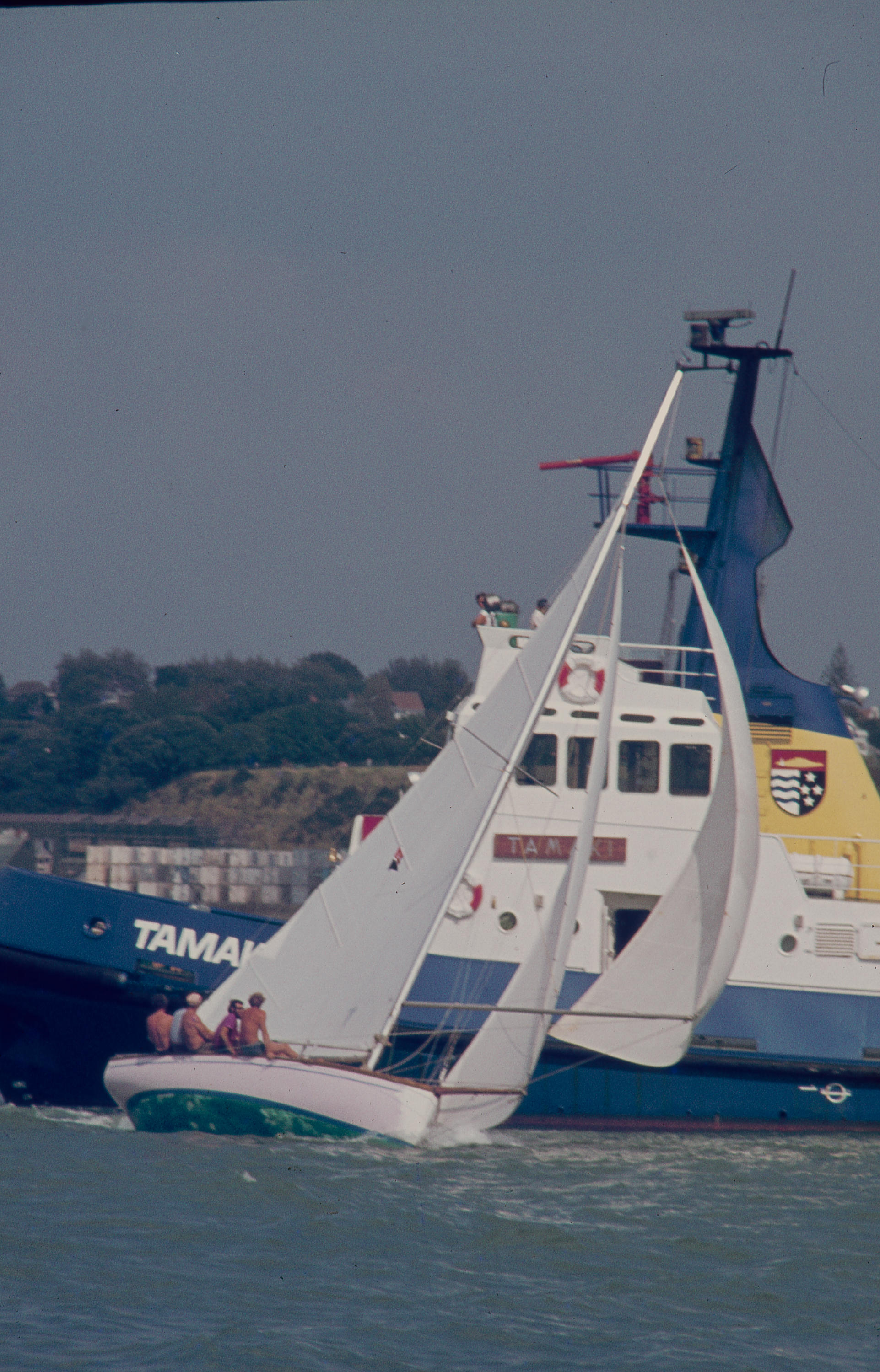 Slide: L-Class Mullet Boat passing in front of larger ship in the 1977 ...