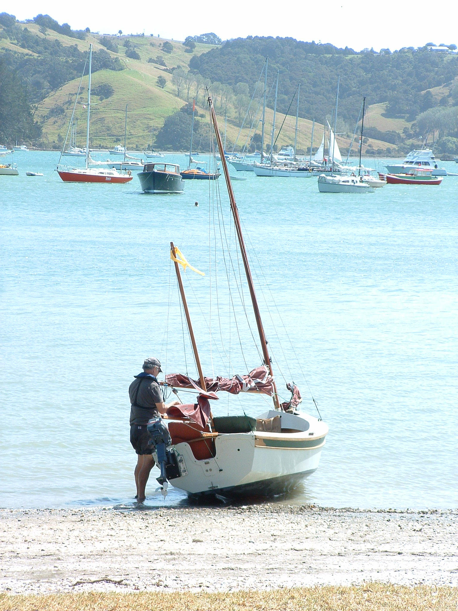 Photograph: Yacht on beach on Mahurangi Harbour, Hauraki Gulf - New ...