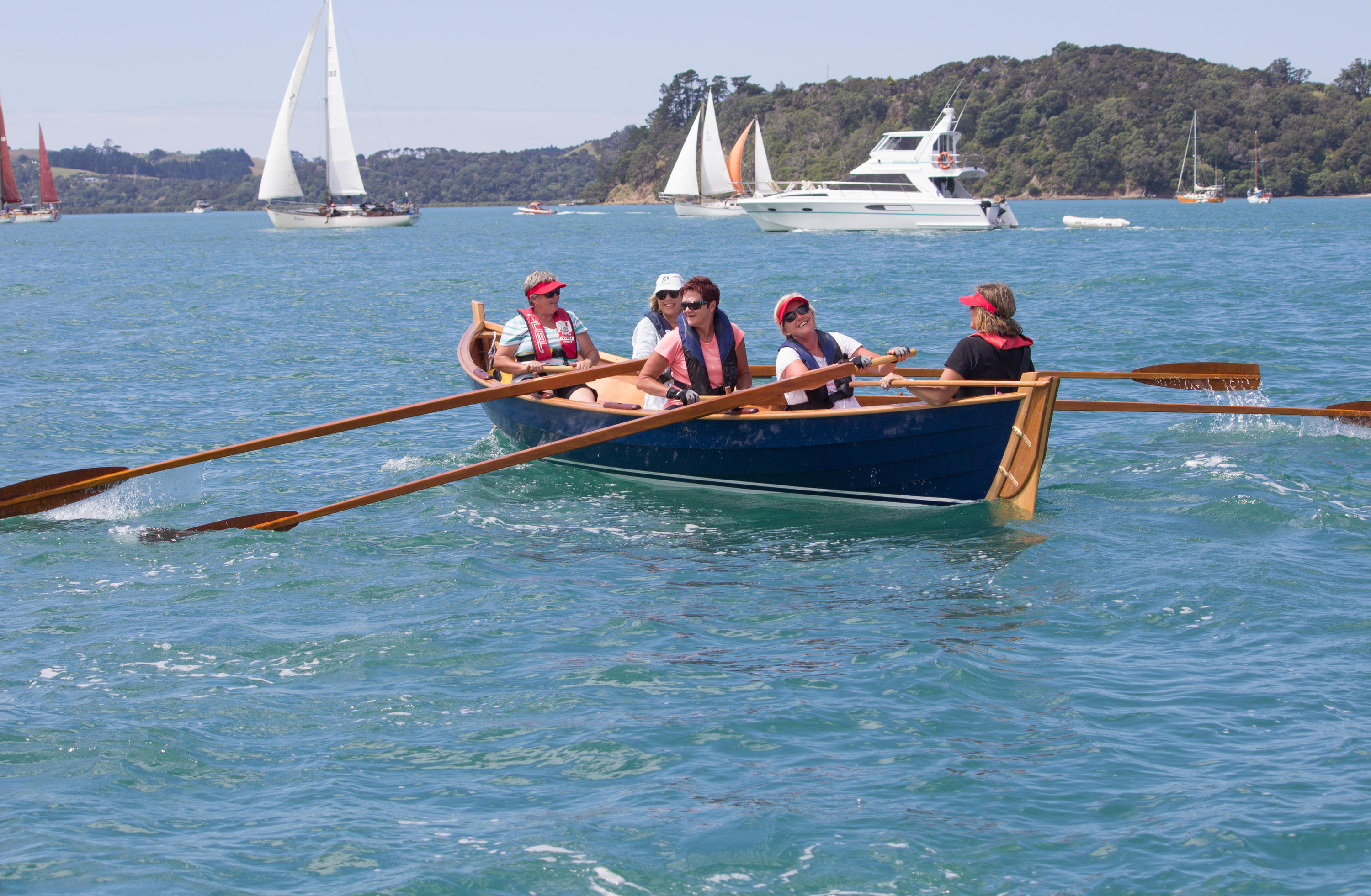 Photograph: Rowing skiff being rowed by crews on Mahurangi Harbour ...