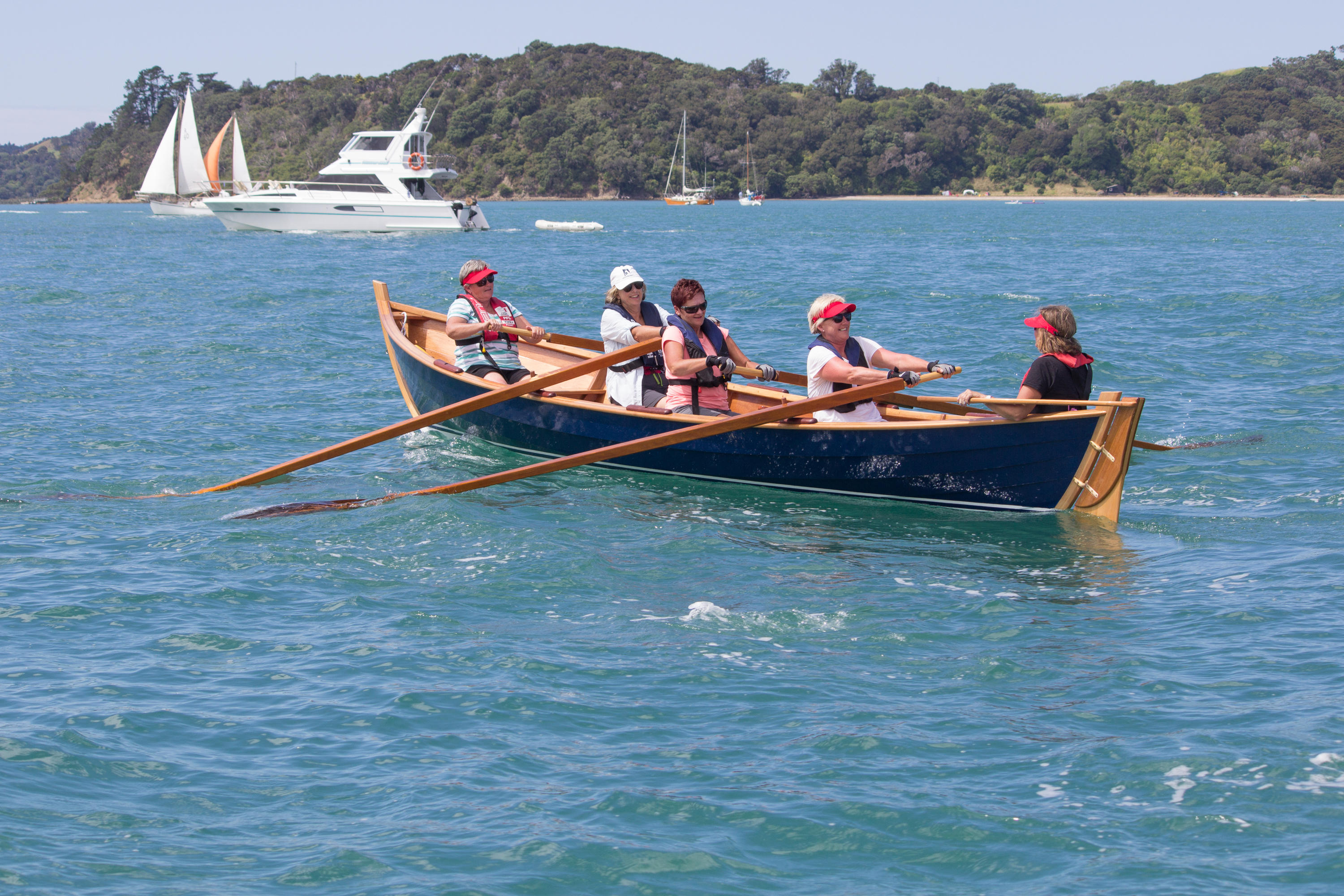 Photograph: Rowing skiff being rowed by crews on Mahurangi Harbour ...