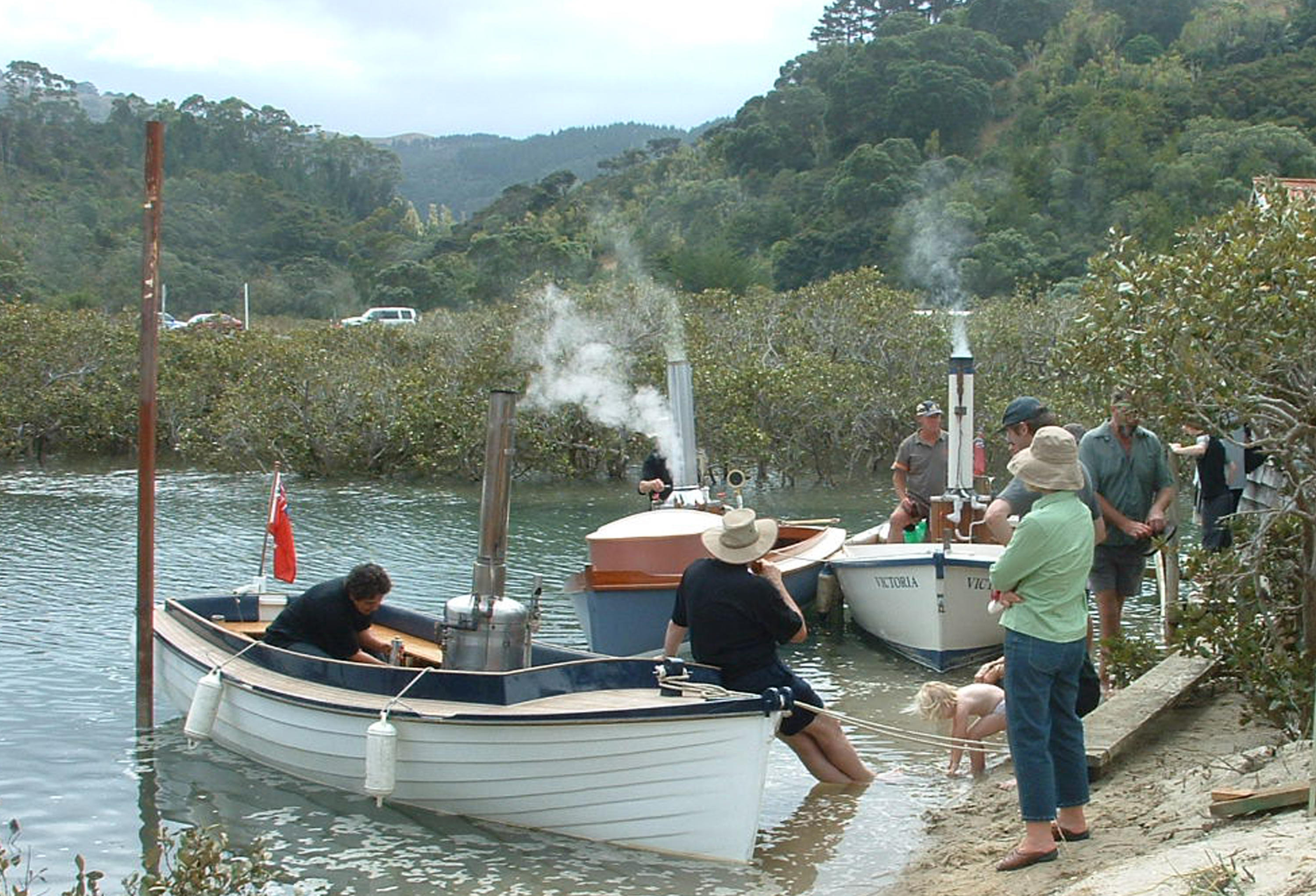 Photograph: VICTORIA and two other steam launches with people onboard ...
