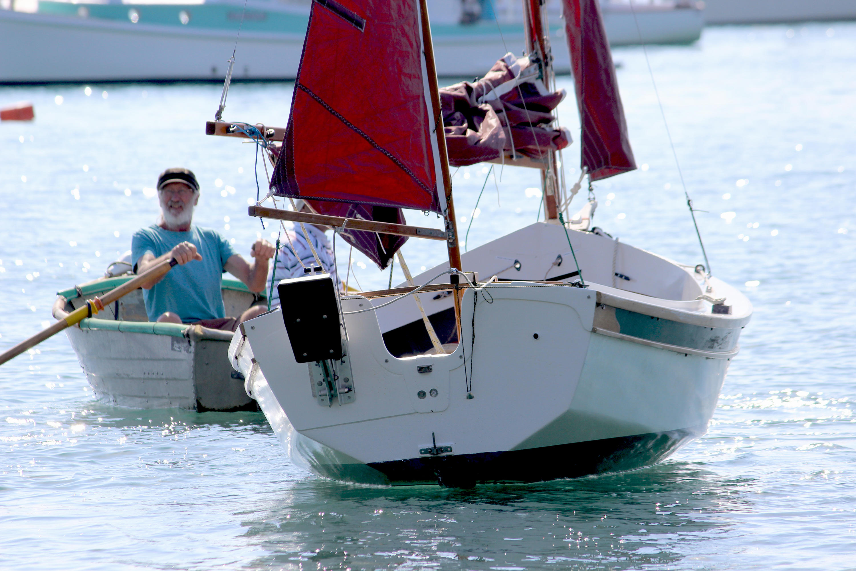 Photograph: People on dinghy beside BESSIE HOUDINI on Mahurangi Harbour ...