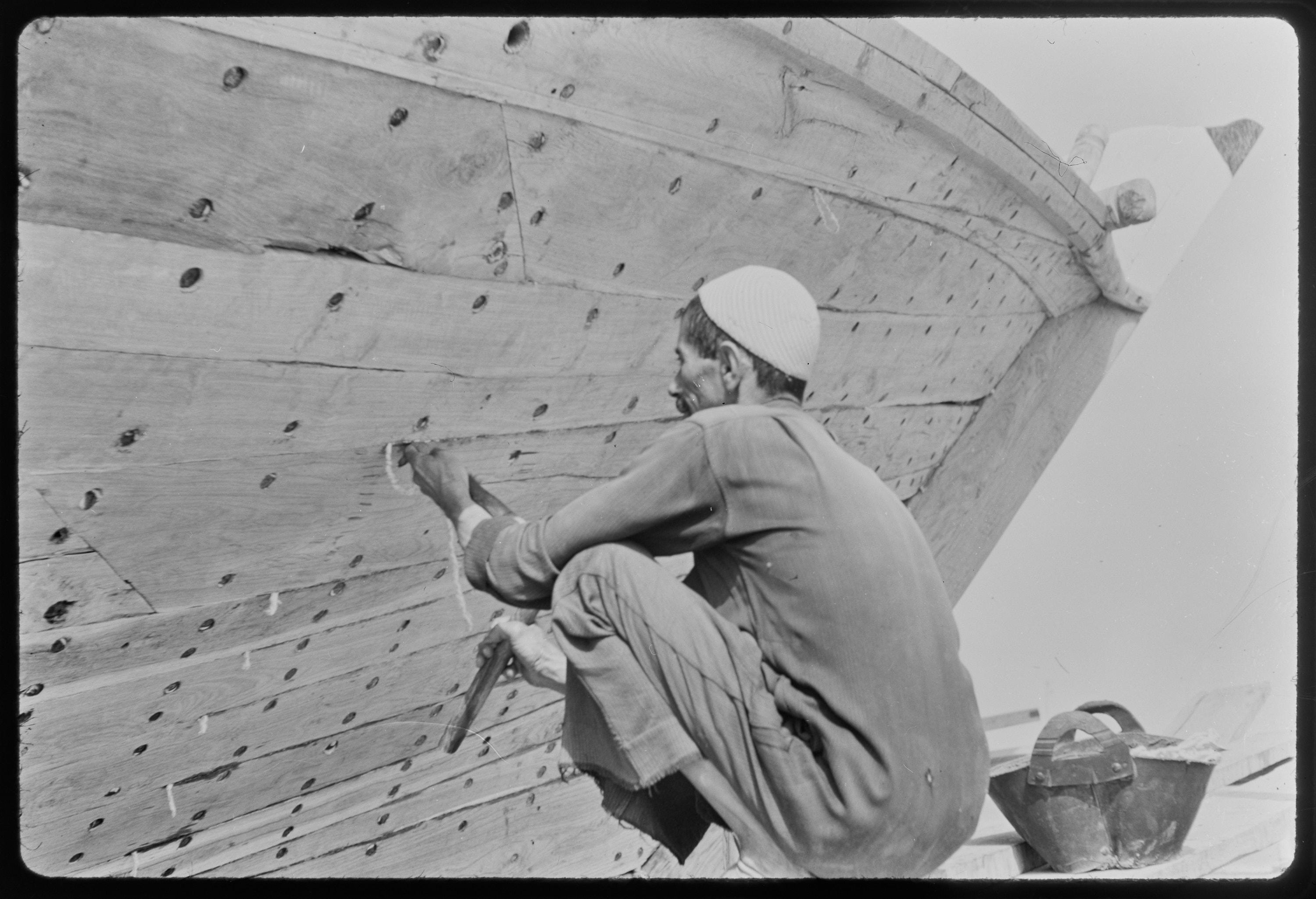 Negative: Shipwright using bow drill, Kuwait, 1967 - New Zealand ...